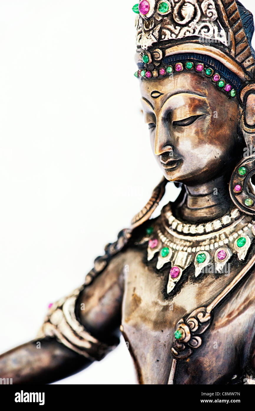 Sitting Indian deity statue on white background Stock Photo - Alamy