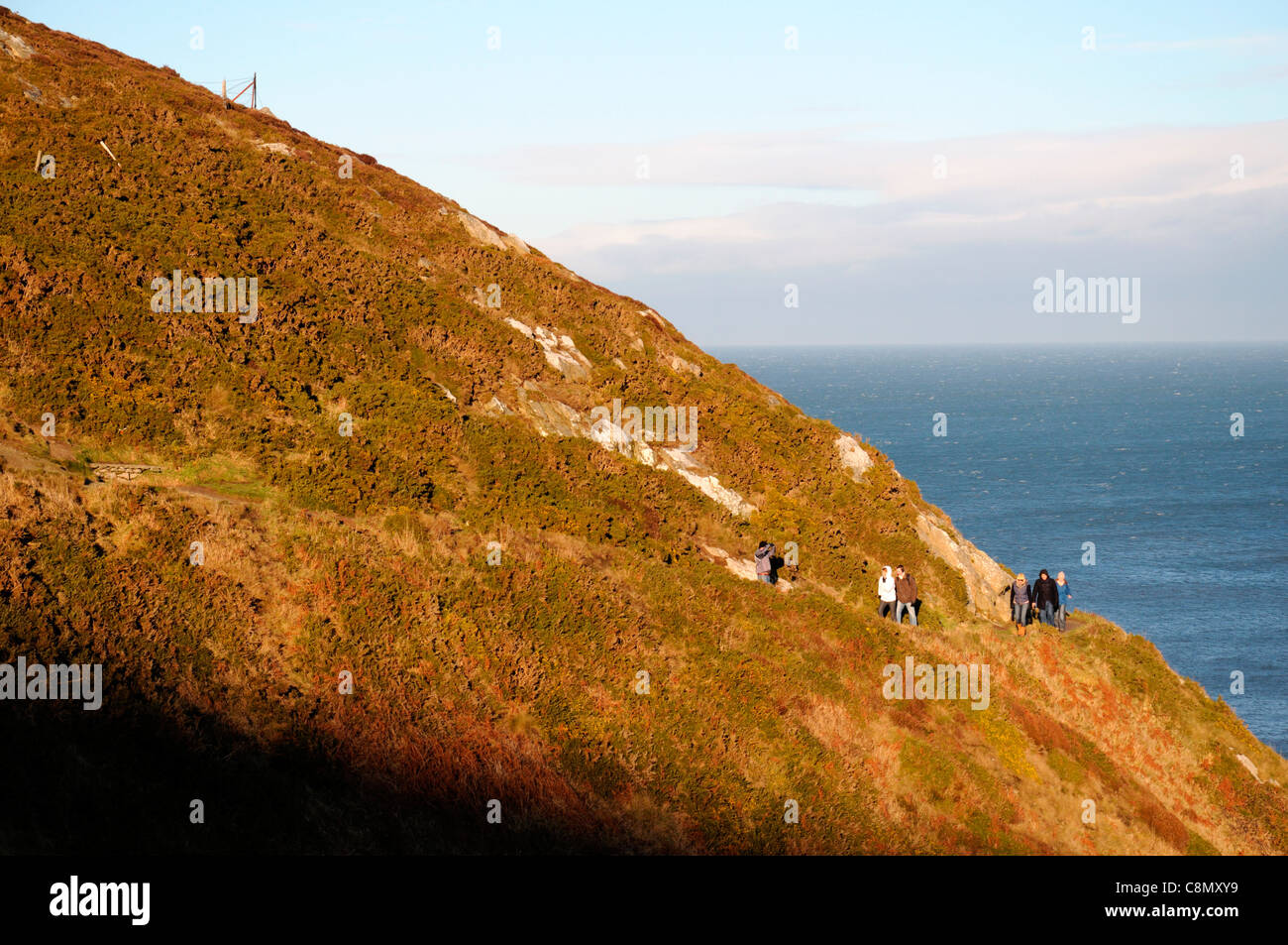 tourists walk walking hike hiking around the trail path pathway on ...