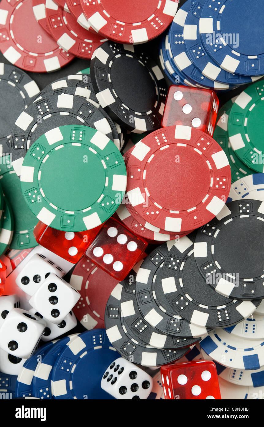 background consists of casino chips and dice game Stock Photo - Alamy