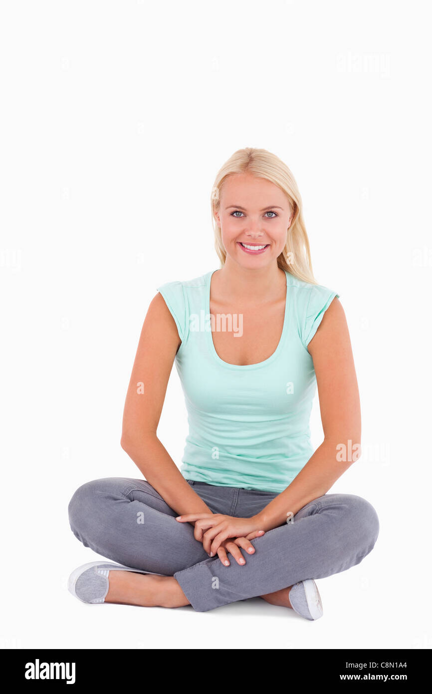 Smiling woman sitting Stock Photo - Alamy