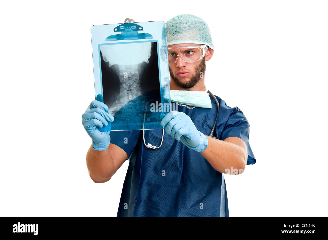 Doctor looking at an X-ray isolated against a white background Stock ...