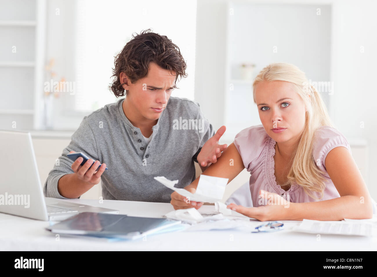 Clueless couple accounting Stock Photo - Alamy