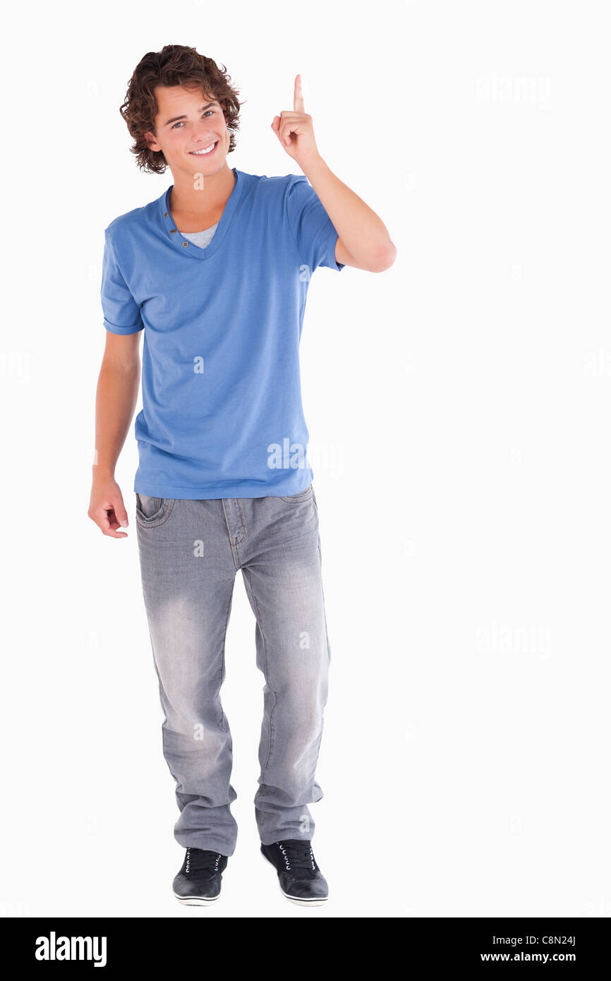 Cute guy pointing at copyspace Stock Photo - Alamy