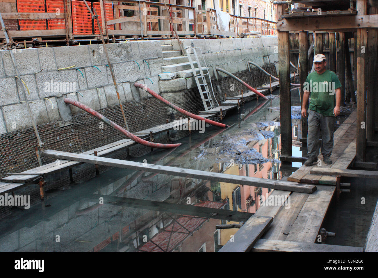 Dry canal dredging maintenance of Venice canals Stock Photo - Alamy