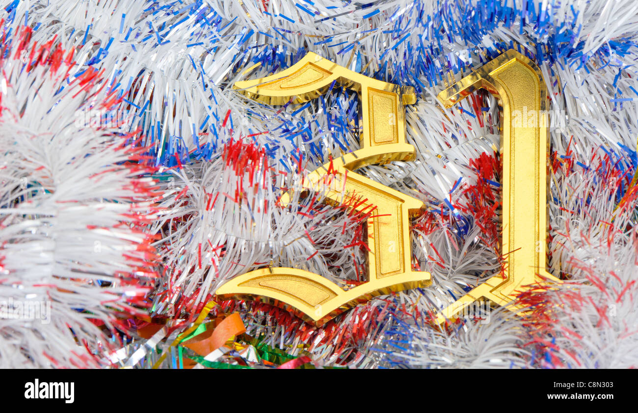 Gold figures 31. Figures lie on a celebratory tinsel.Concept eve of New ...