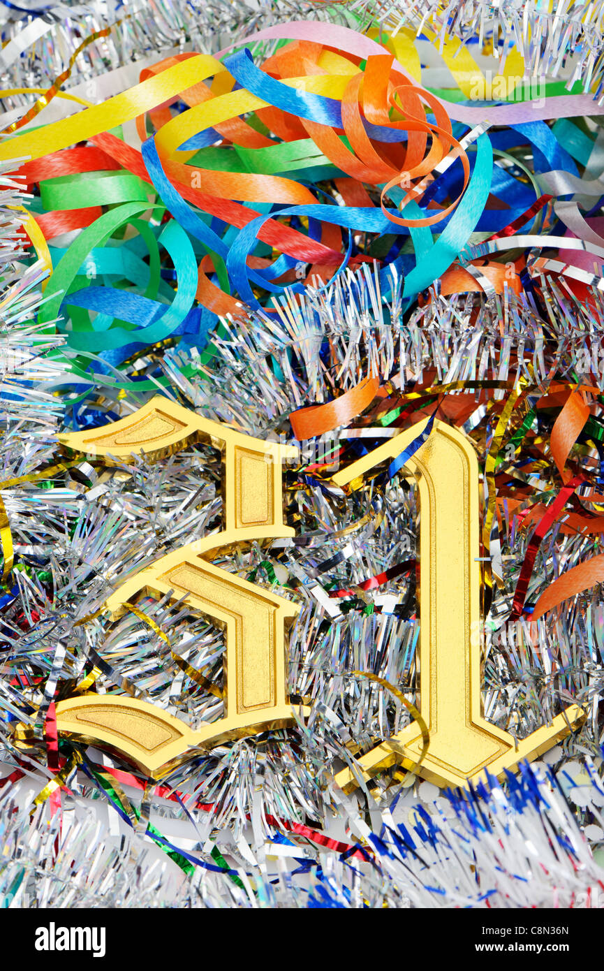 Gold figures 31. Figures lie on a celebratory tinsel.Concept eve of New ...