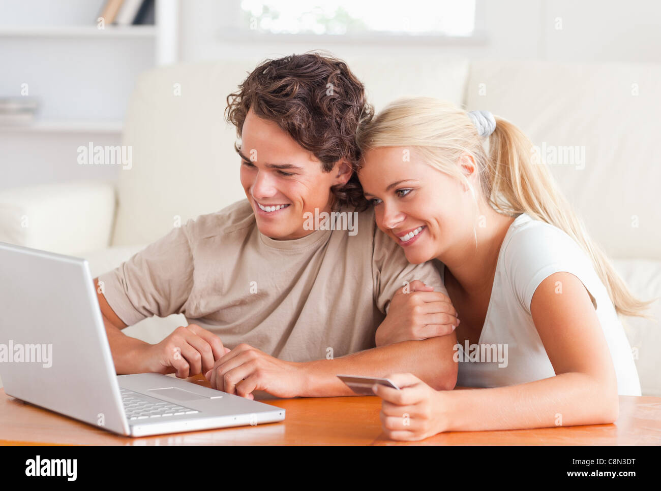 Cute couple with a laptop Stock Photo - Alamy
