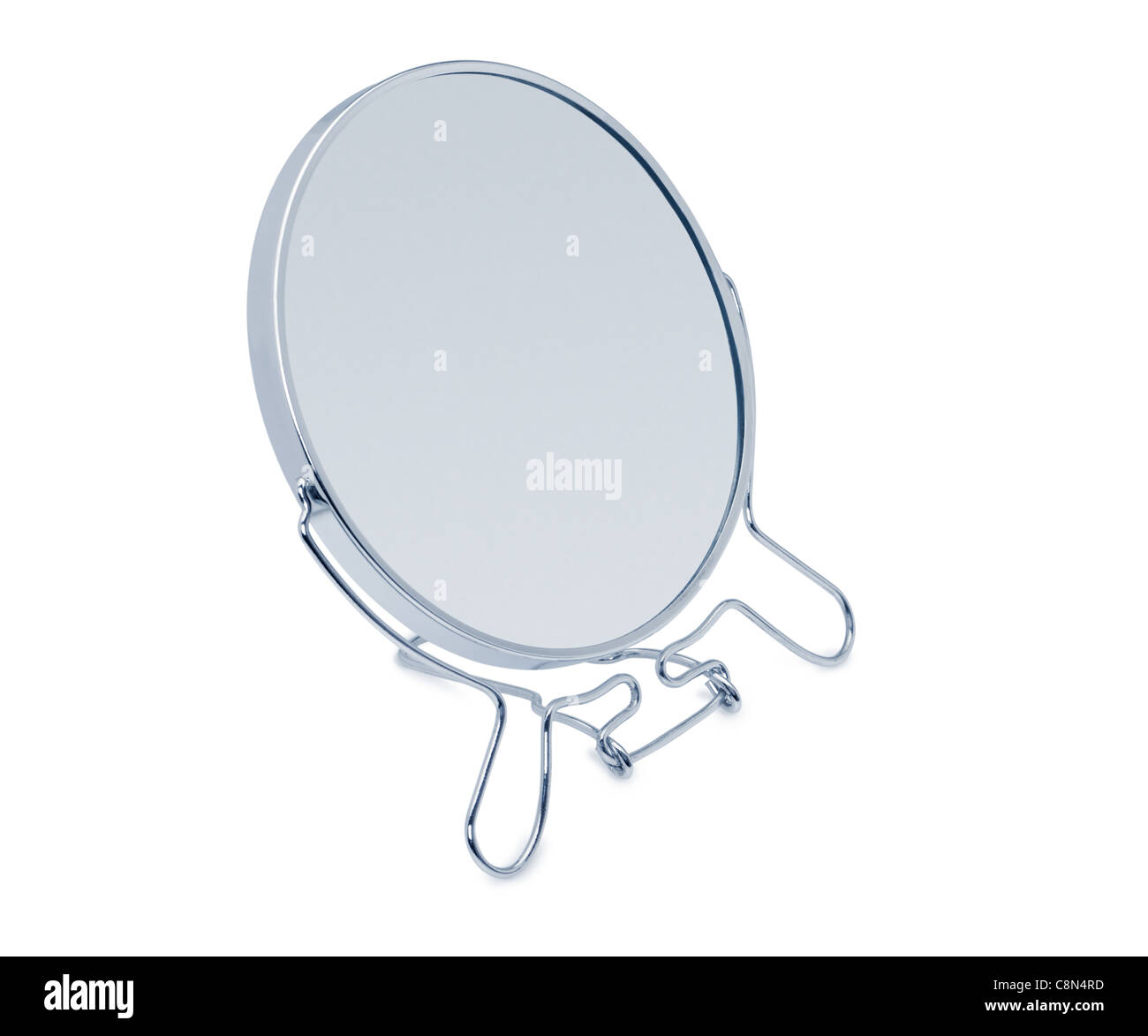 Mirror with shadow. The mirror in an iron frame is isolated on a white ...