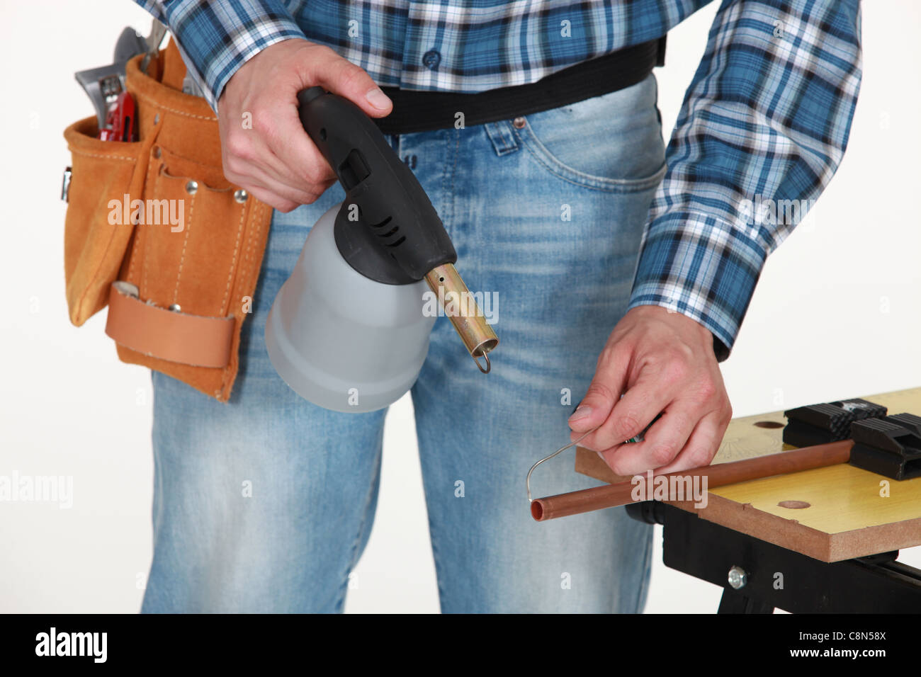 Tradesman using a blowtorch Stock Photo - Alamy