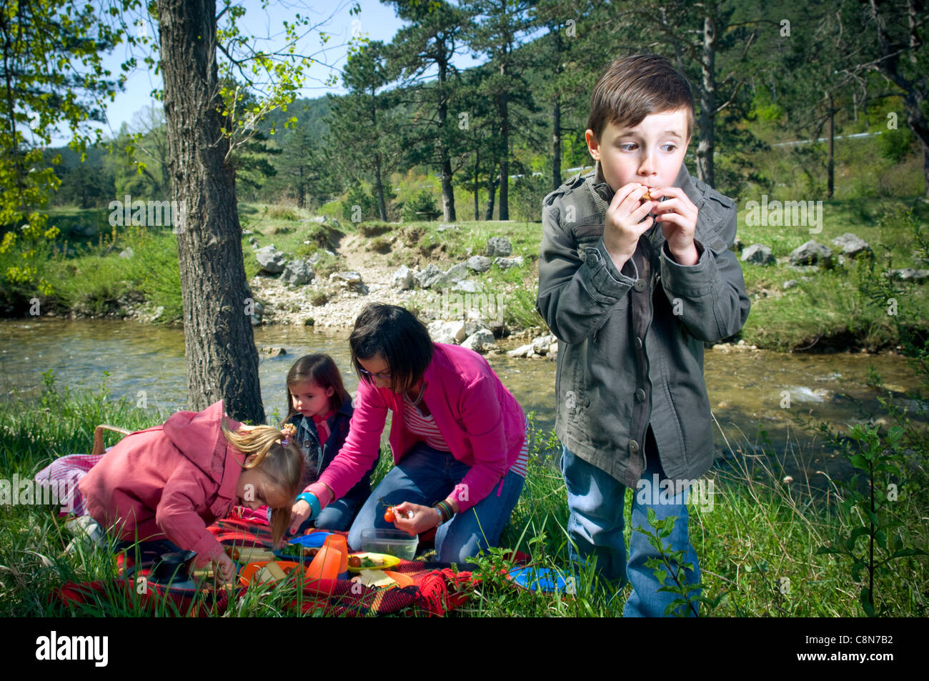 Selfish boy eating cookie Stock Photo - Alamy