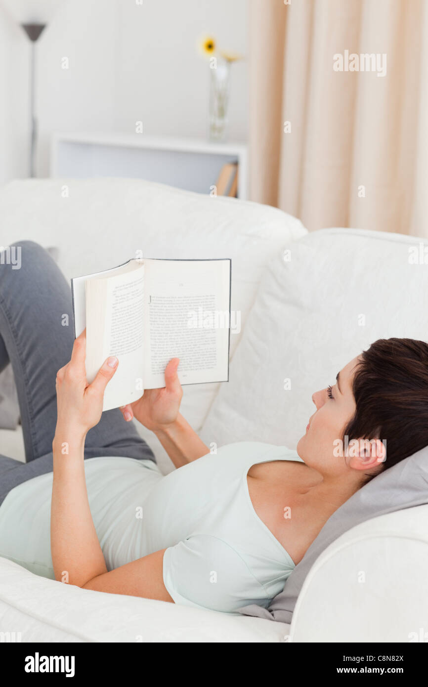 Short-haired woman reading a book Stock Photo - Alamy