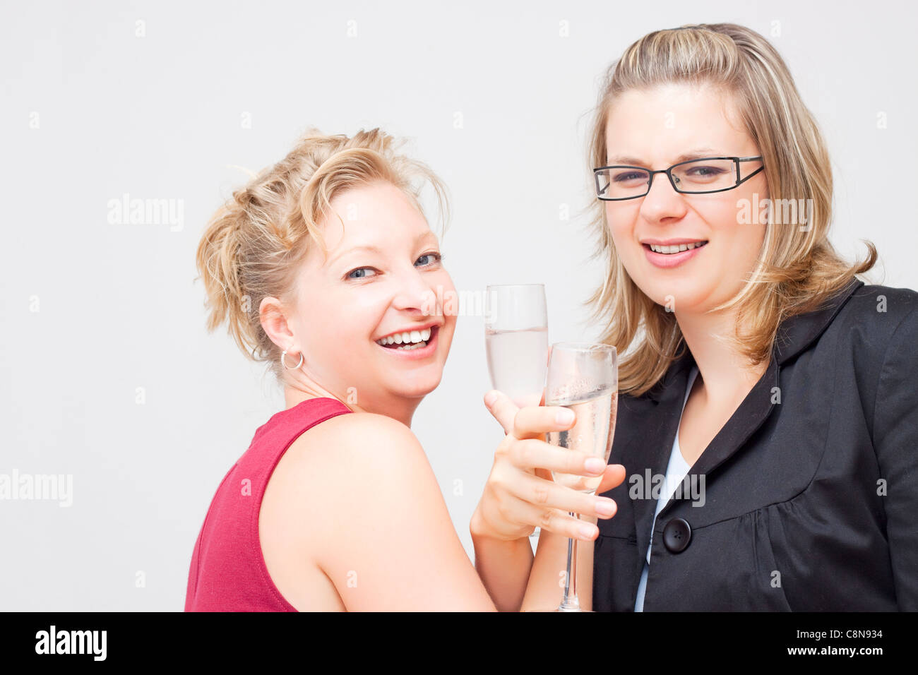 Two women celebrate success Stock Photo - Alamy