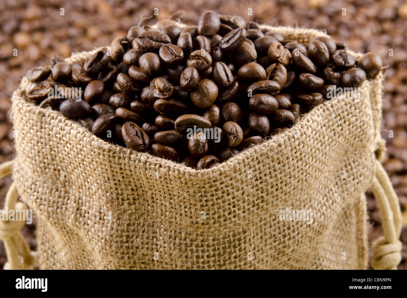 freshly roasted coffee beans in a jute bag Stock Photo - Alamy