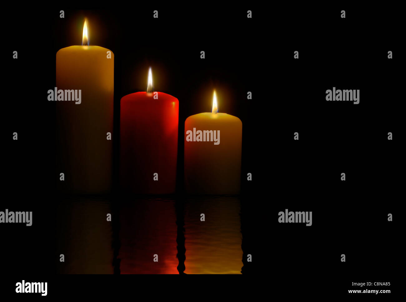Three candles over a black background and its reflection Stock Photo ...