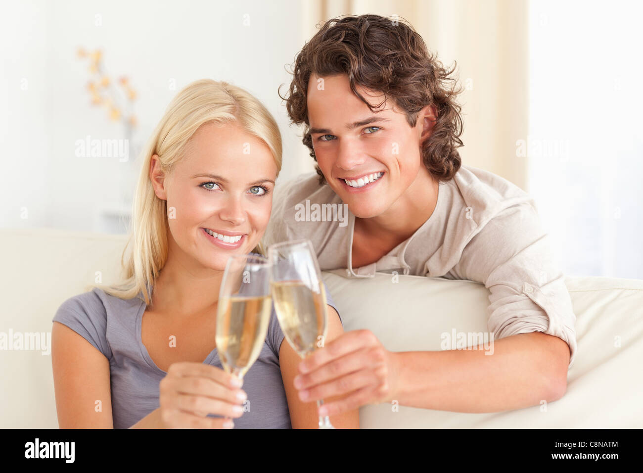 Lovely couple making a toast Stock Photo - Alamy