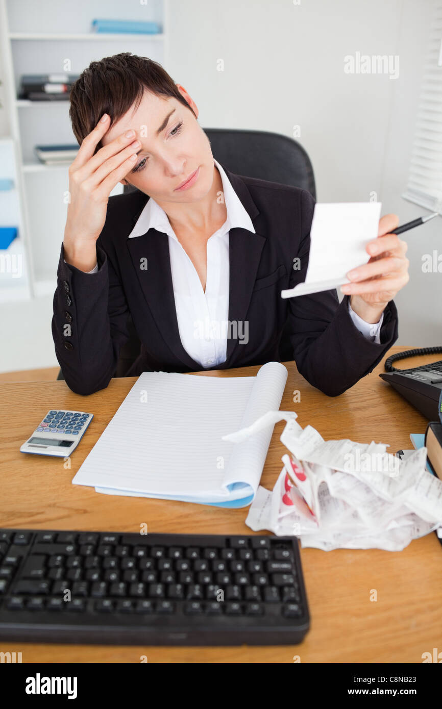 Portrait of a serious accountant checking receipts Stock Photo - Alamy