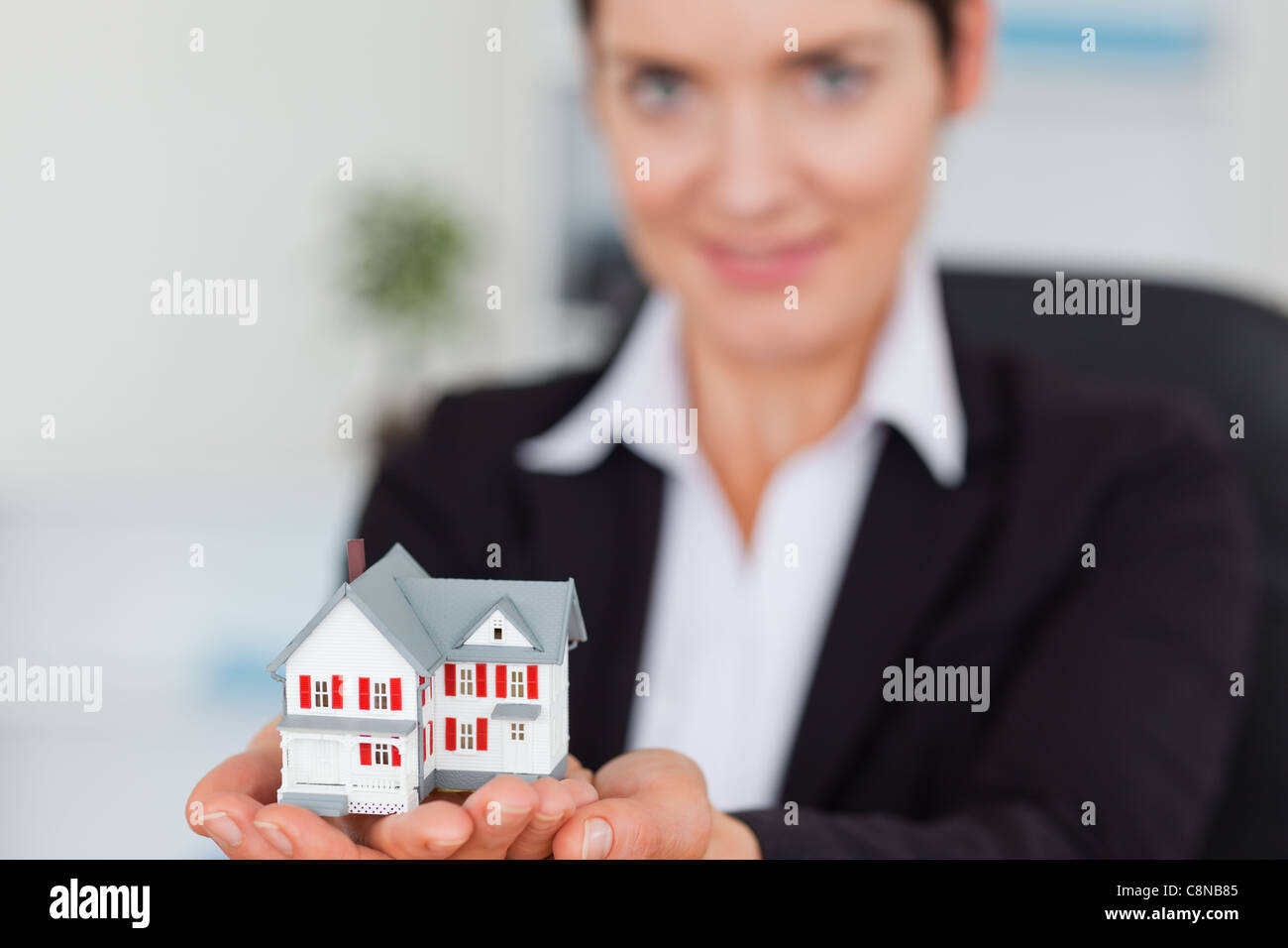 Happy architect holding miniature hi-res stock photography and images ...