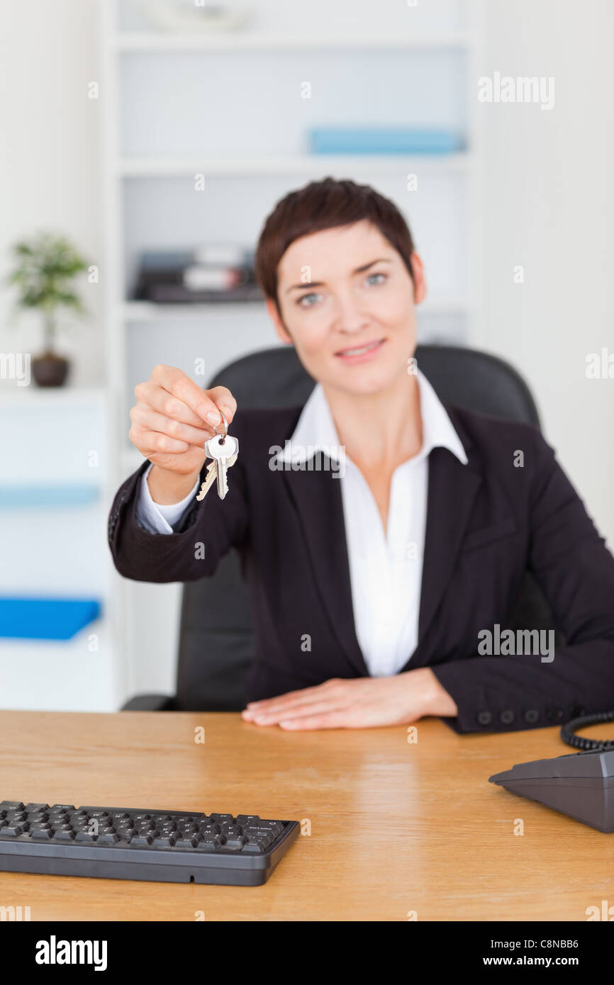Secretary showing keys Stock Photo - Alamy