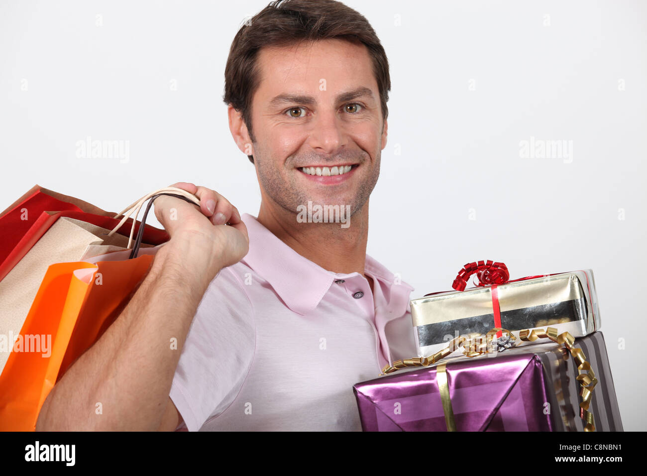 Man with presents Stock Photo - Alamy
