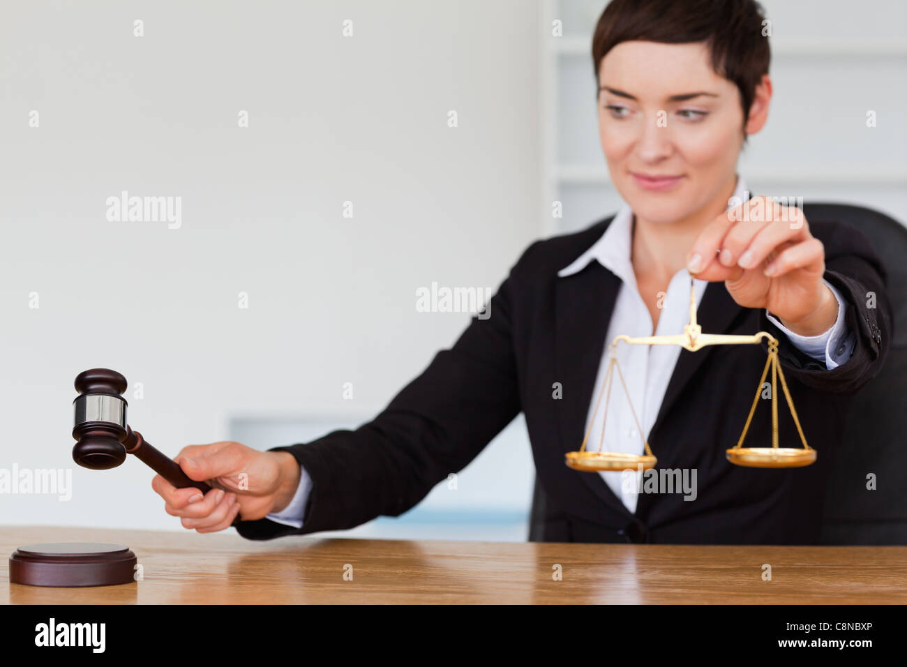 Young judge with a gavel and the justice scale Stock Photo - Alamy