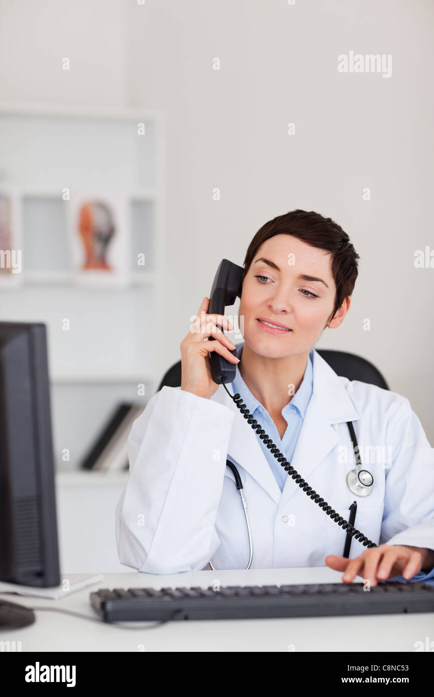 Portrait of a female doctor making a phone call Stock Photo - Alamy