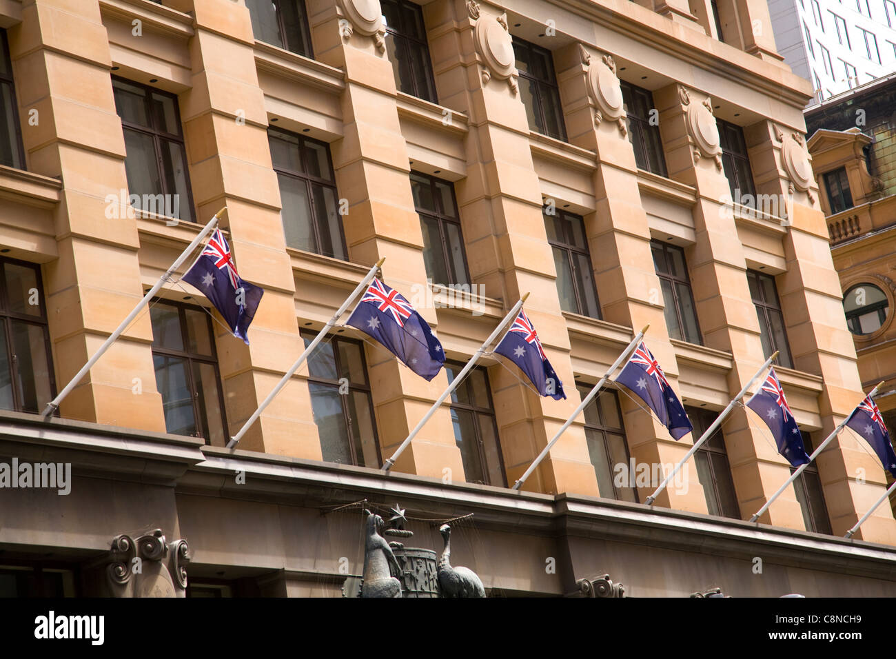 6 australian flags fly outside office building in martins place,sydney ...