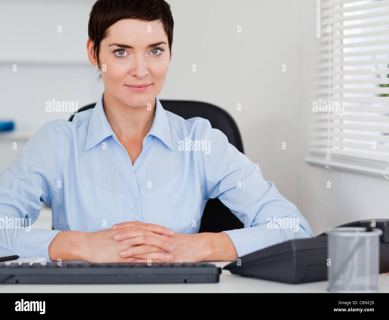 Serious business woman posing Stock Photo - Alamy