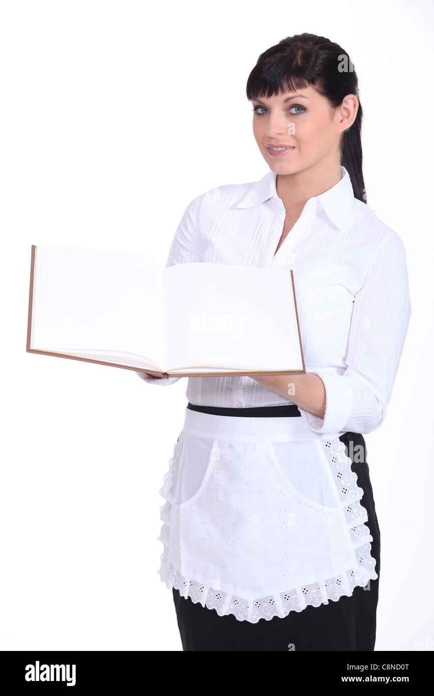 Waitress holding menu Stock Photo - Alamy