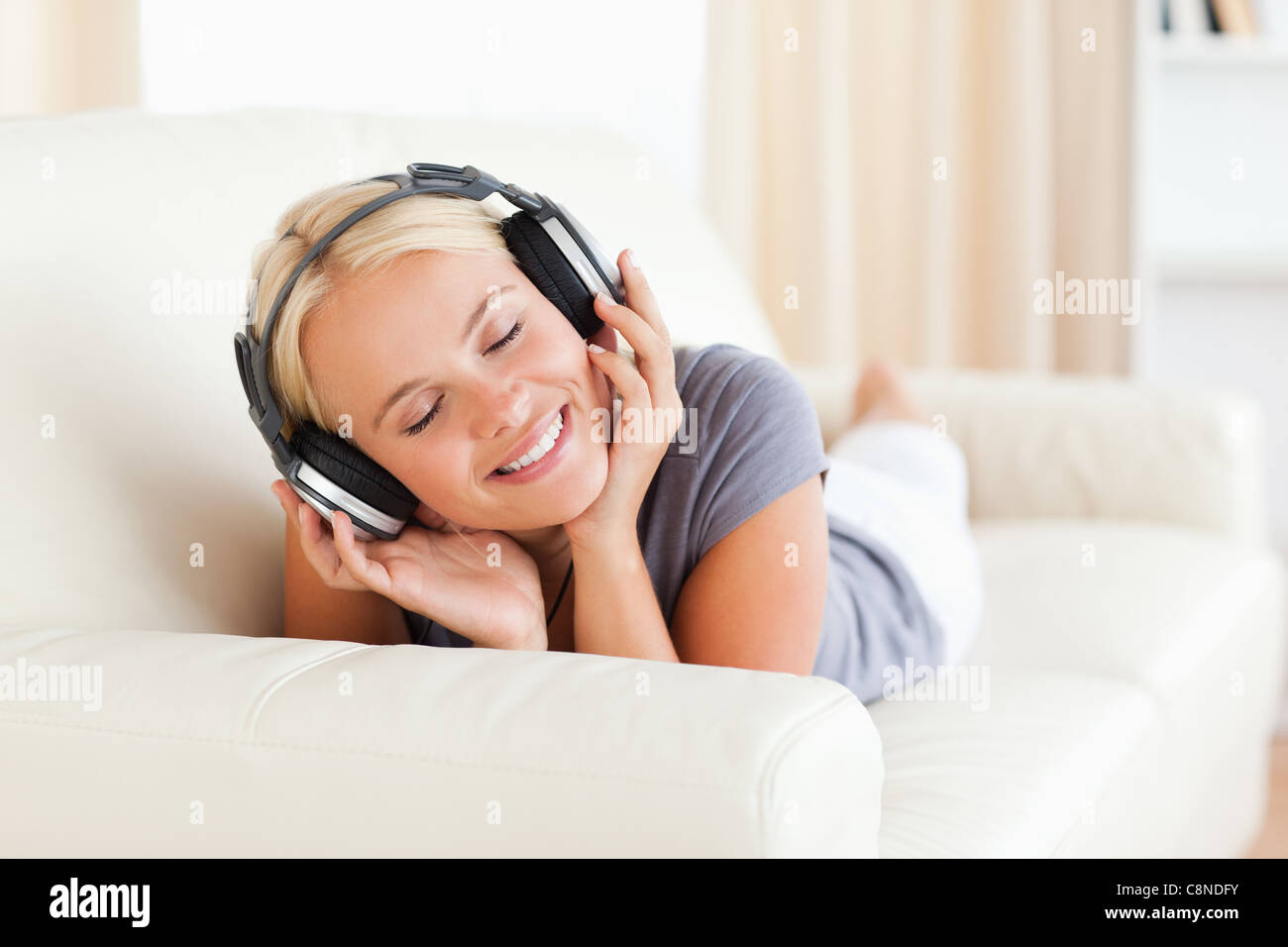 Woman enjoying some music Stock Photo - Alamy