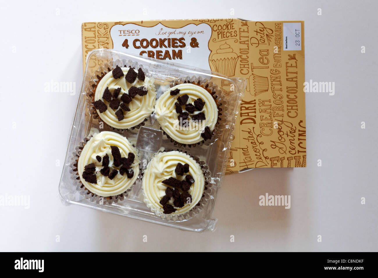 packet of Tesco 4 cookies & cream cupcakes isolated on white background ...