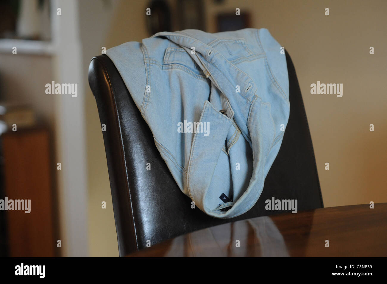 Jacket hung over back of chair hi-res stock photography and images - Alamy
