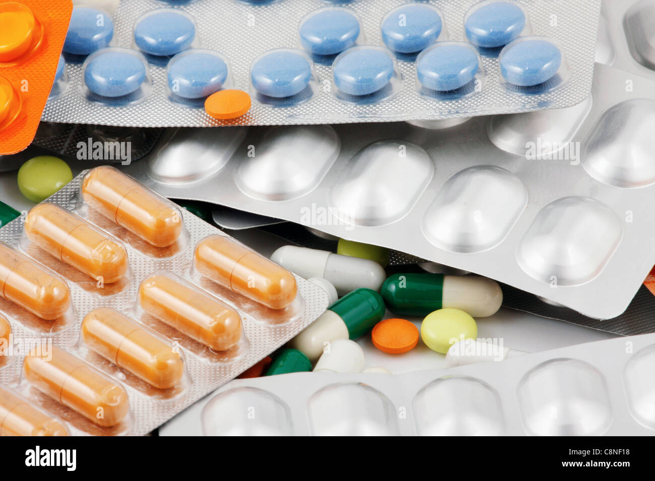 Pills of many shapes and colors Stock Photo - Alamy