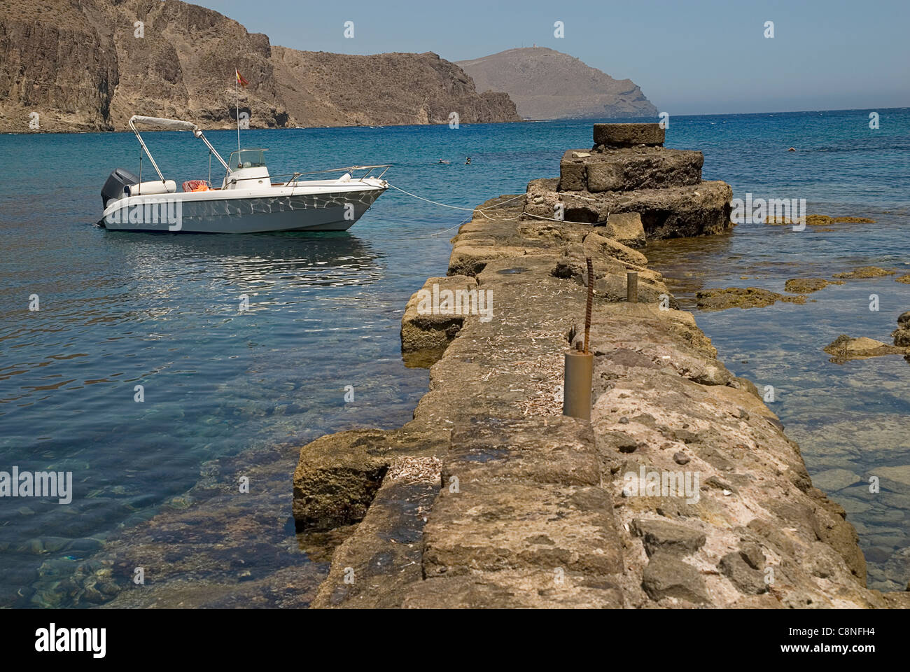 Spain, Andalucia, Almeria, La Isleta del Moro, old stone jetty with ...