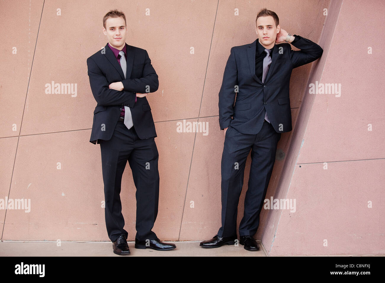 A set of handsome young identical twin businessmen Stock Photo - Alamy