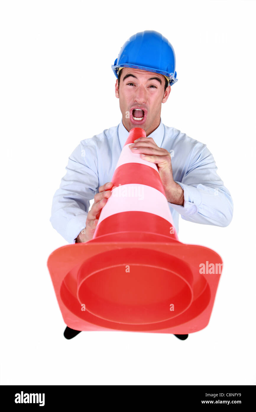 Man shouting into traffic cone Stock Photo - Alamy