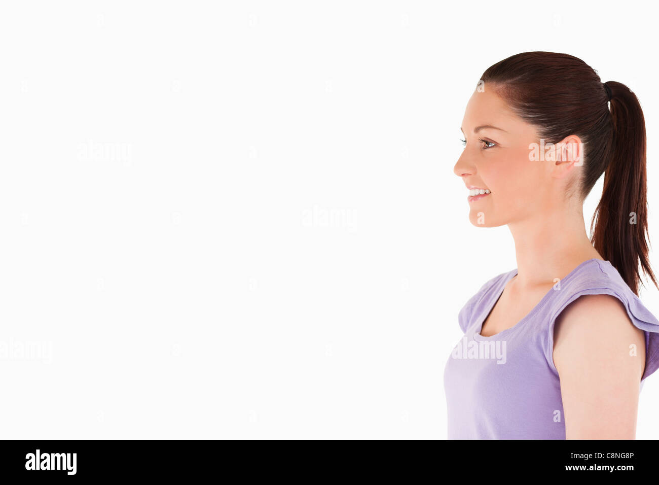 Beautiful female posing while standing Stock Photo - Alamy