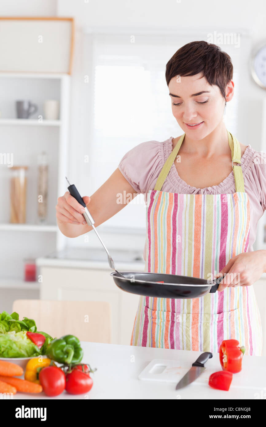 Smiling Woman with a pan Stock Photo - Alamy