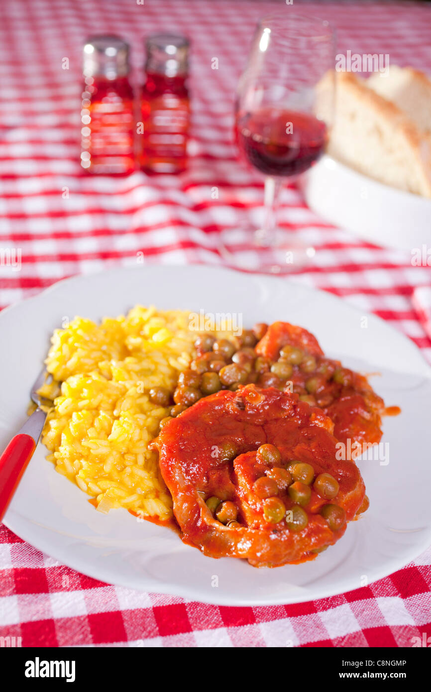 Osso buco (braised shin of veal) with saffron yellow risotto alla ...