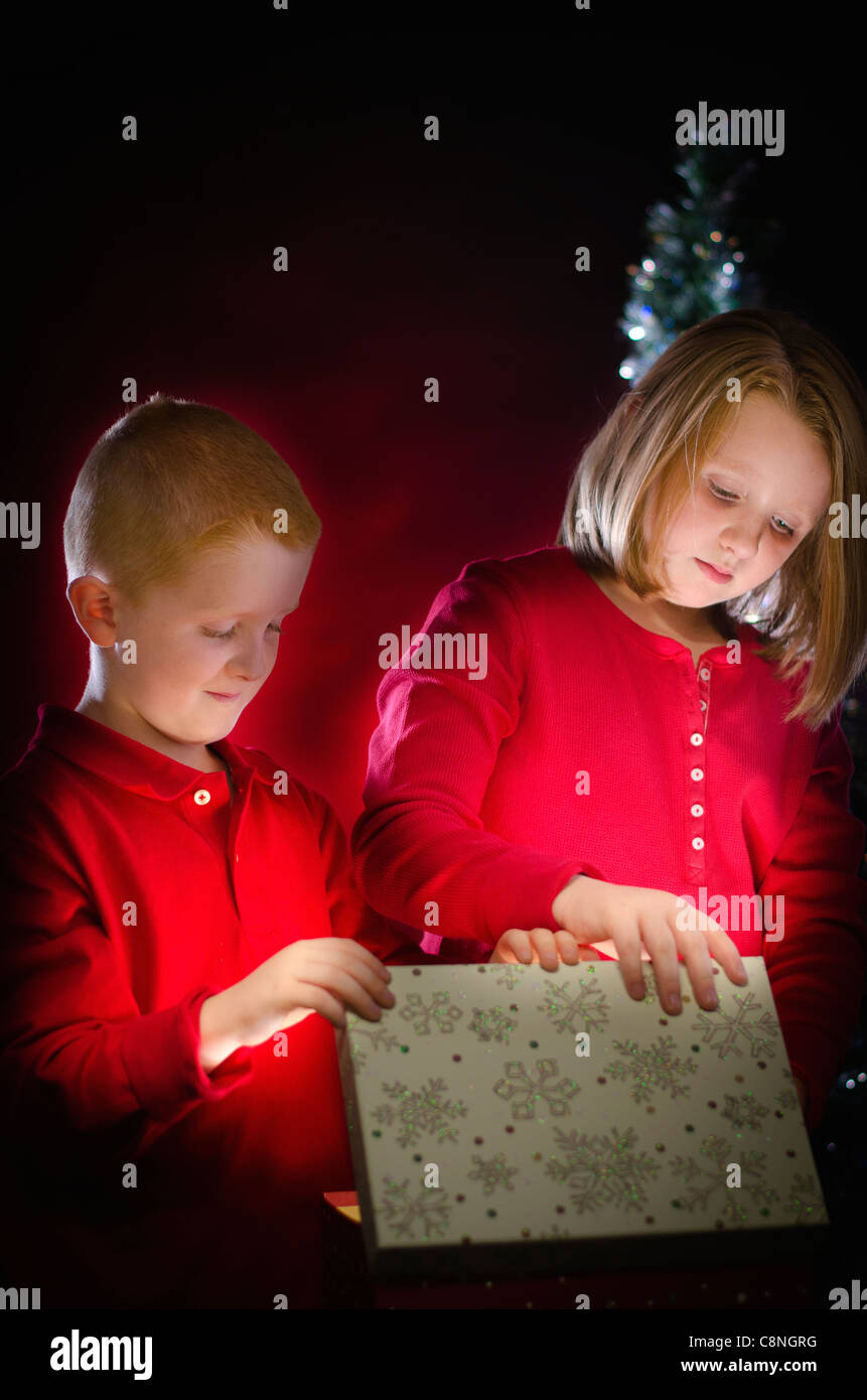 Child getting present christmas hi-res stock photography and images - Alamy