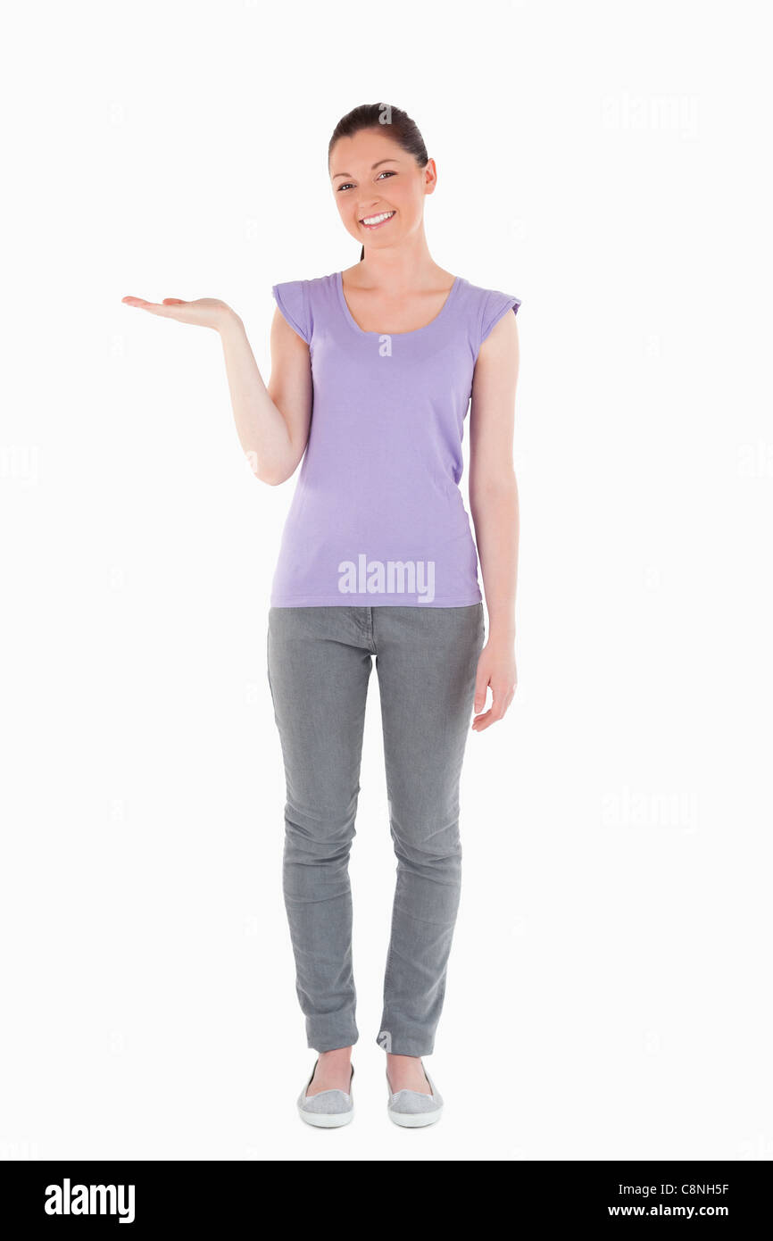 Attractive woman showing a copy space Stock Photo - Alamy