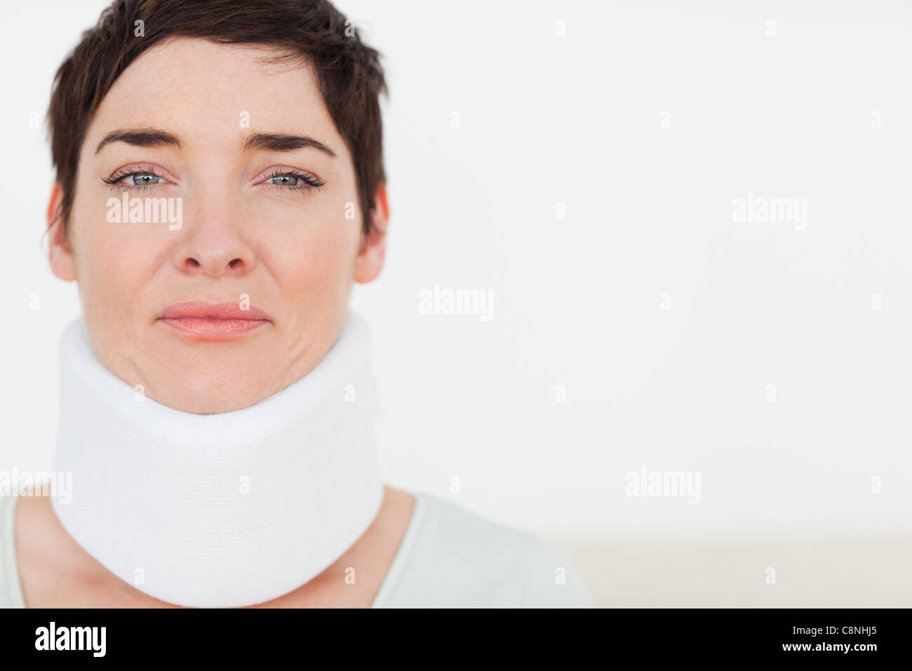Close up of a sad Woman with a surgical collar Stock Photo - Alamy