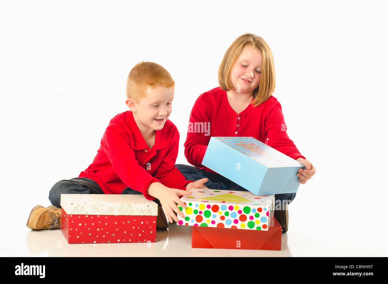 Children opening Christmas presents Stock Photo - Alamy