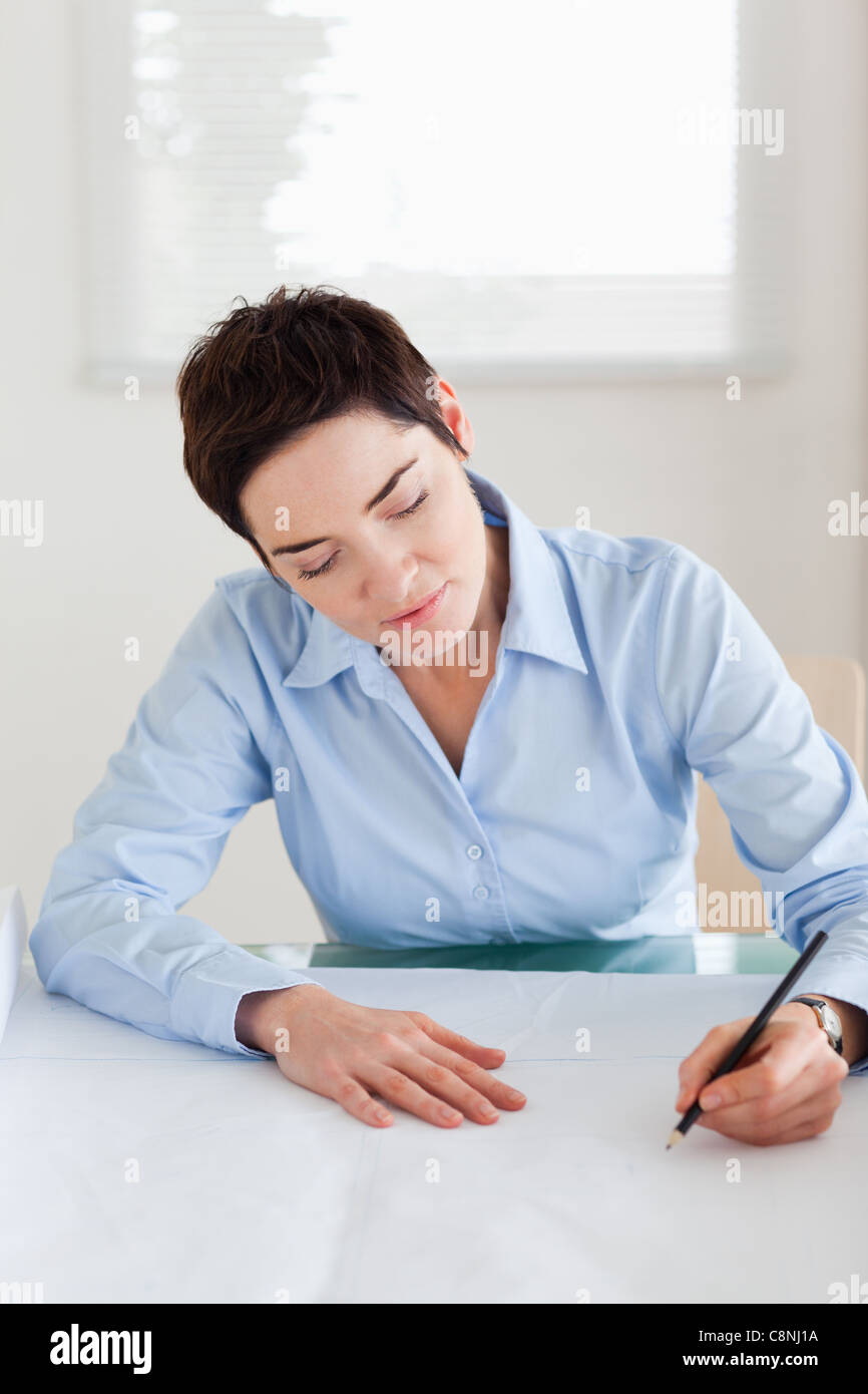 Charming woman with a architectural plan Stock Photo - Alamy
