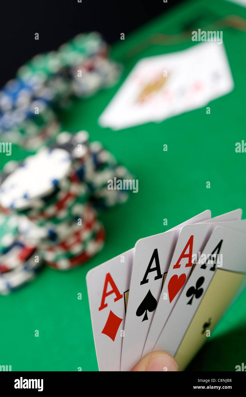 poker aces and gambling chips stacked on a table Stock Photo - Alamy