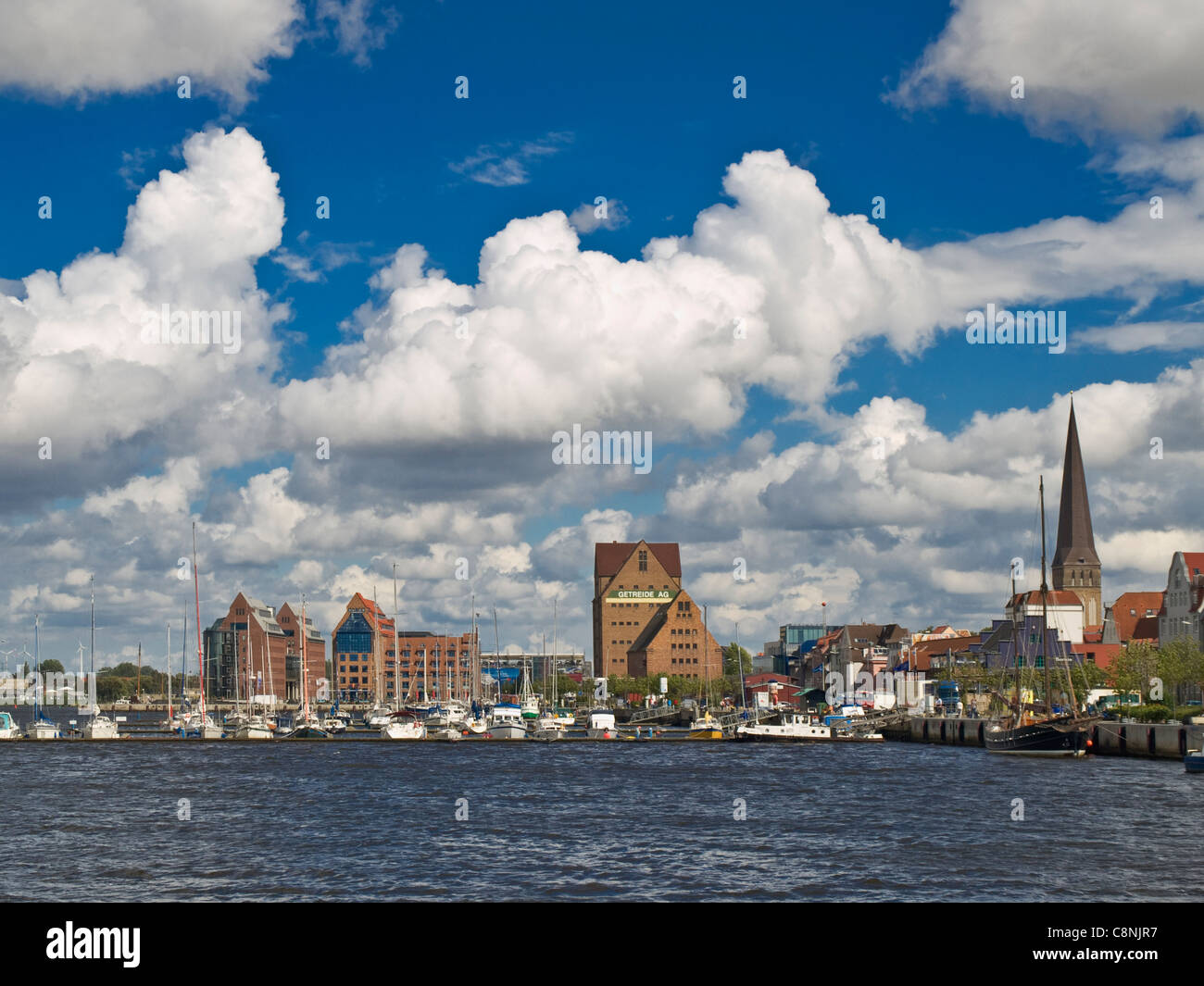 View over the Warnow River to the City Port and St. Peter's Church ...