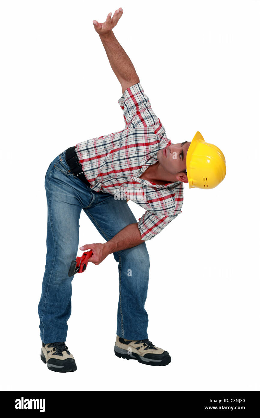 Construction worker with his arm up Stock Photo - Alamy