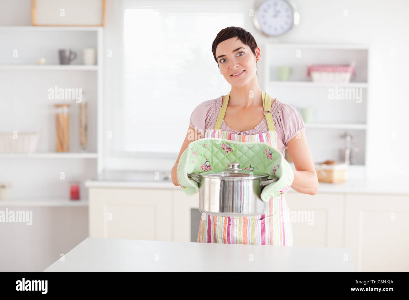 Gorgeous Woman holding a pot Stock Photo - Alamy