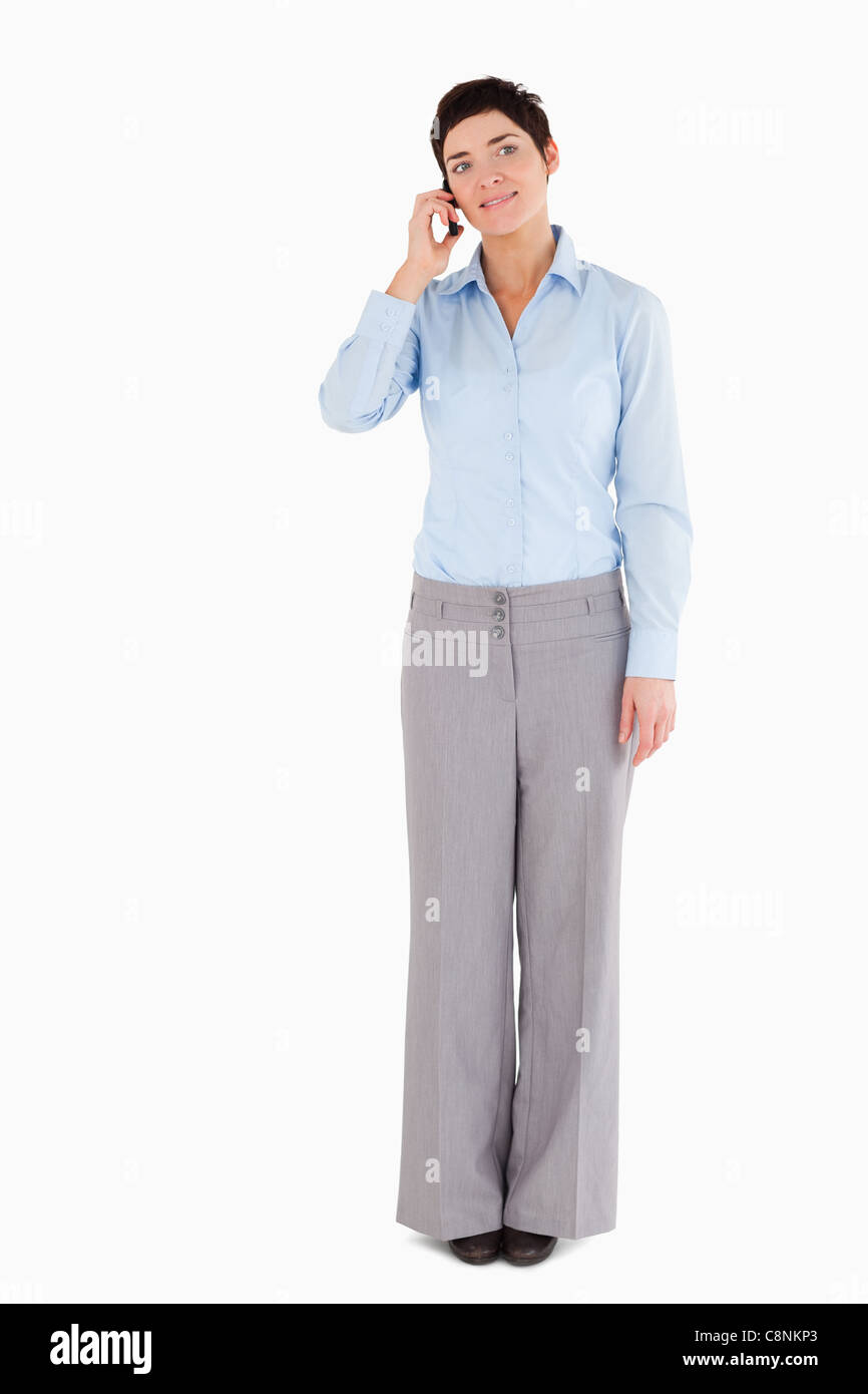 Serious woman making a phone call Stock Photo - Alamy