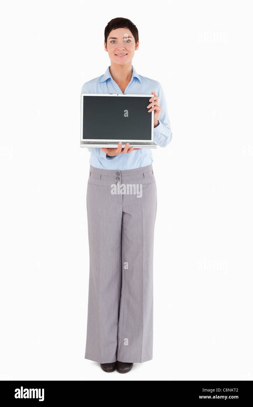 Woman showing a laptop Stock Photo - Alamy