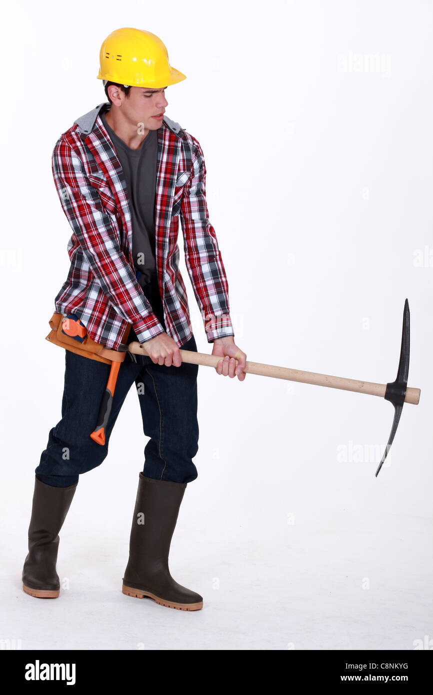 craftsman holding a pick Stock Photo - Alamy